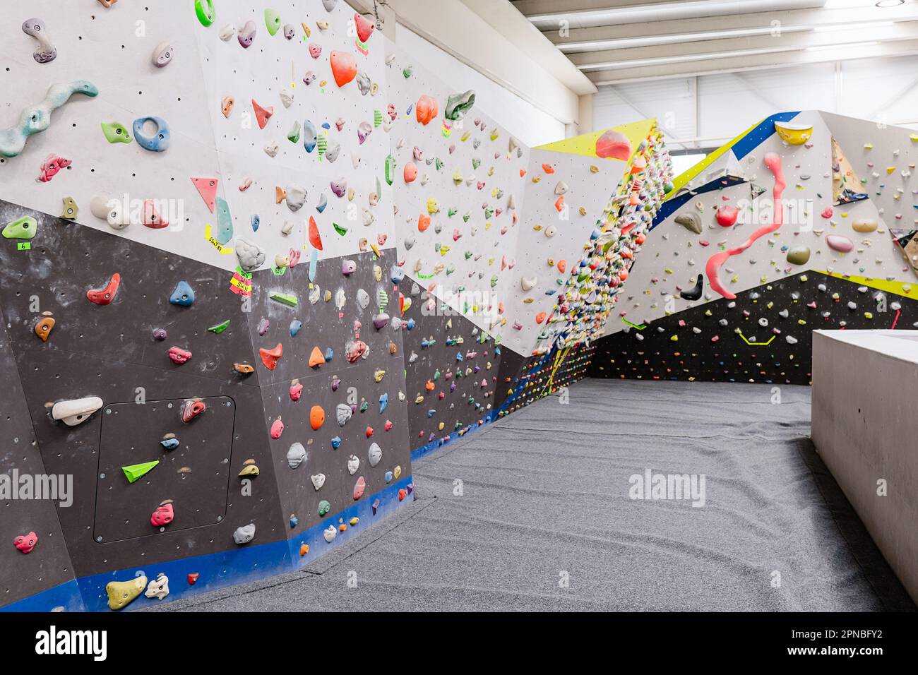 High angle view of various bouldering walls with color coded grips in ...