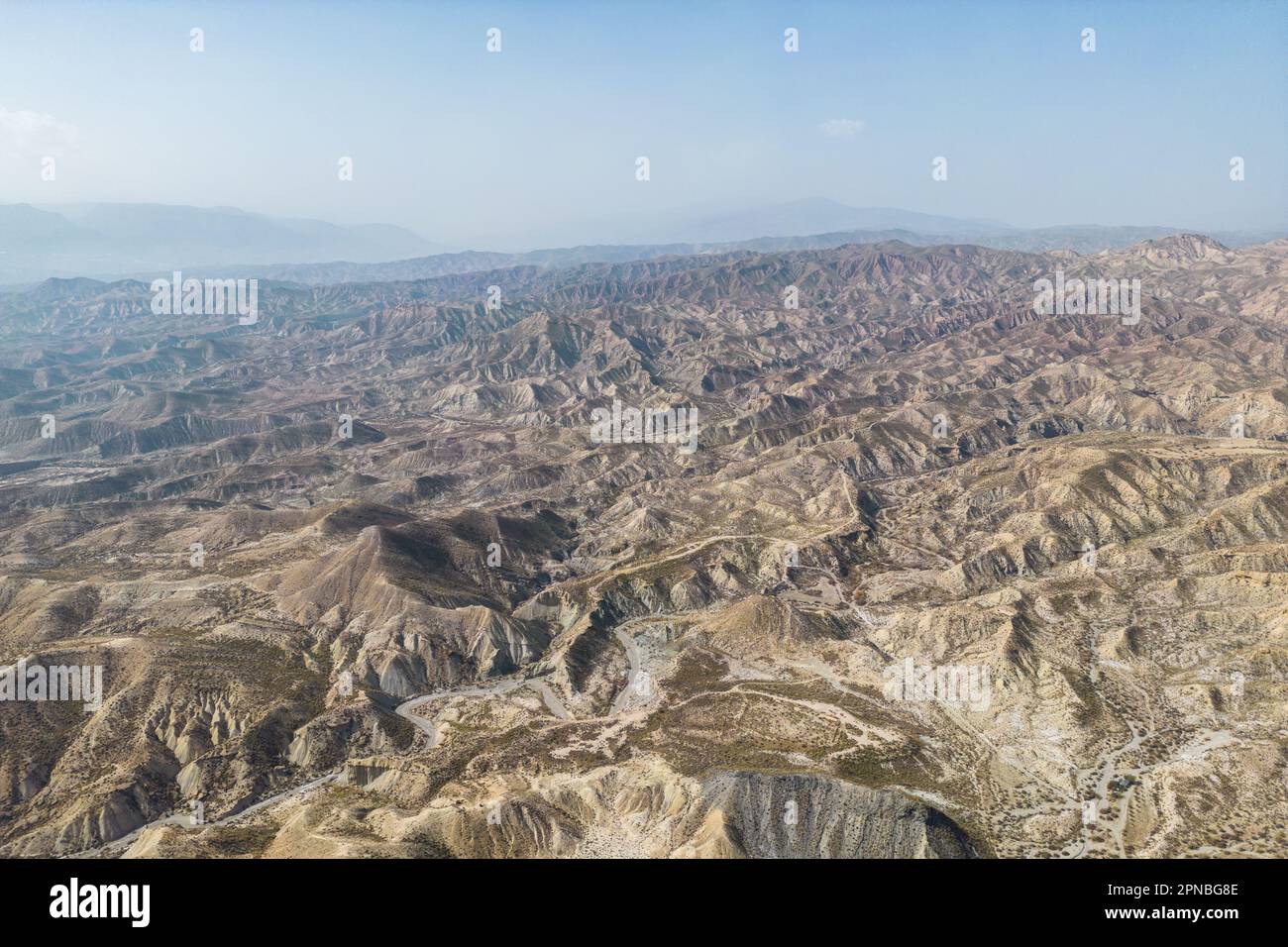 Aerial view of rough rugged mounts with uneven surface forming natural ...