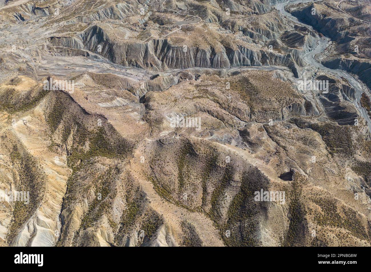 Aerial view of rough rugged mounts with uneven surface forming natural ...