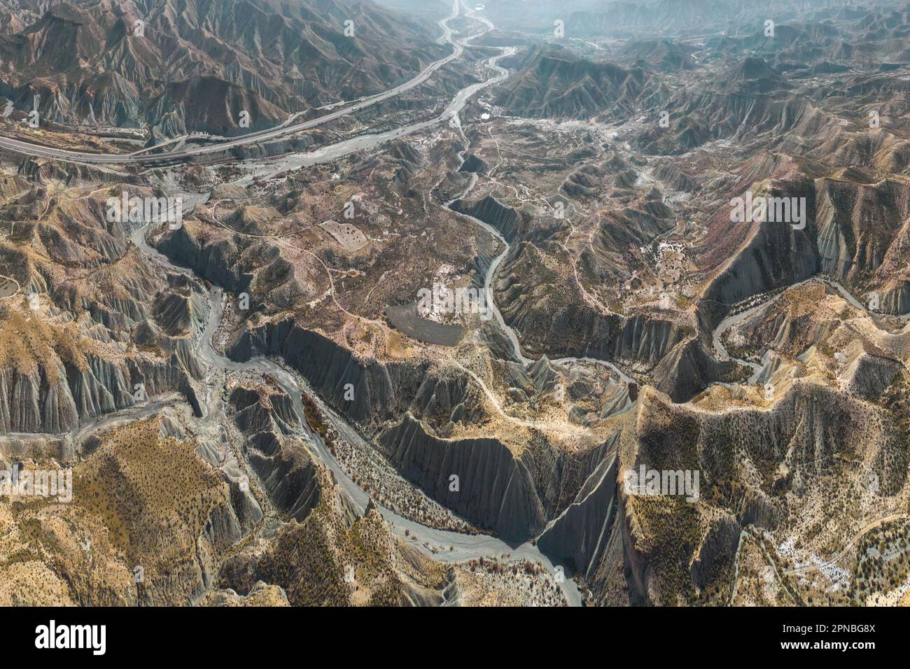 Aerial view of rough rugged mounts with uneven surface forming natural ...