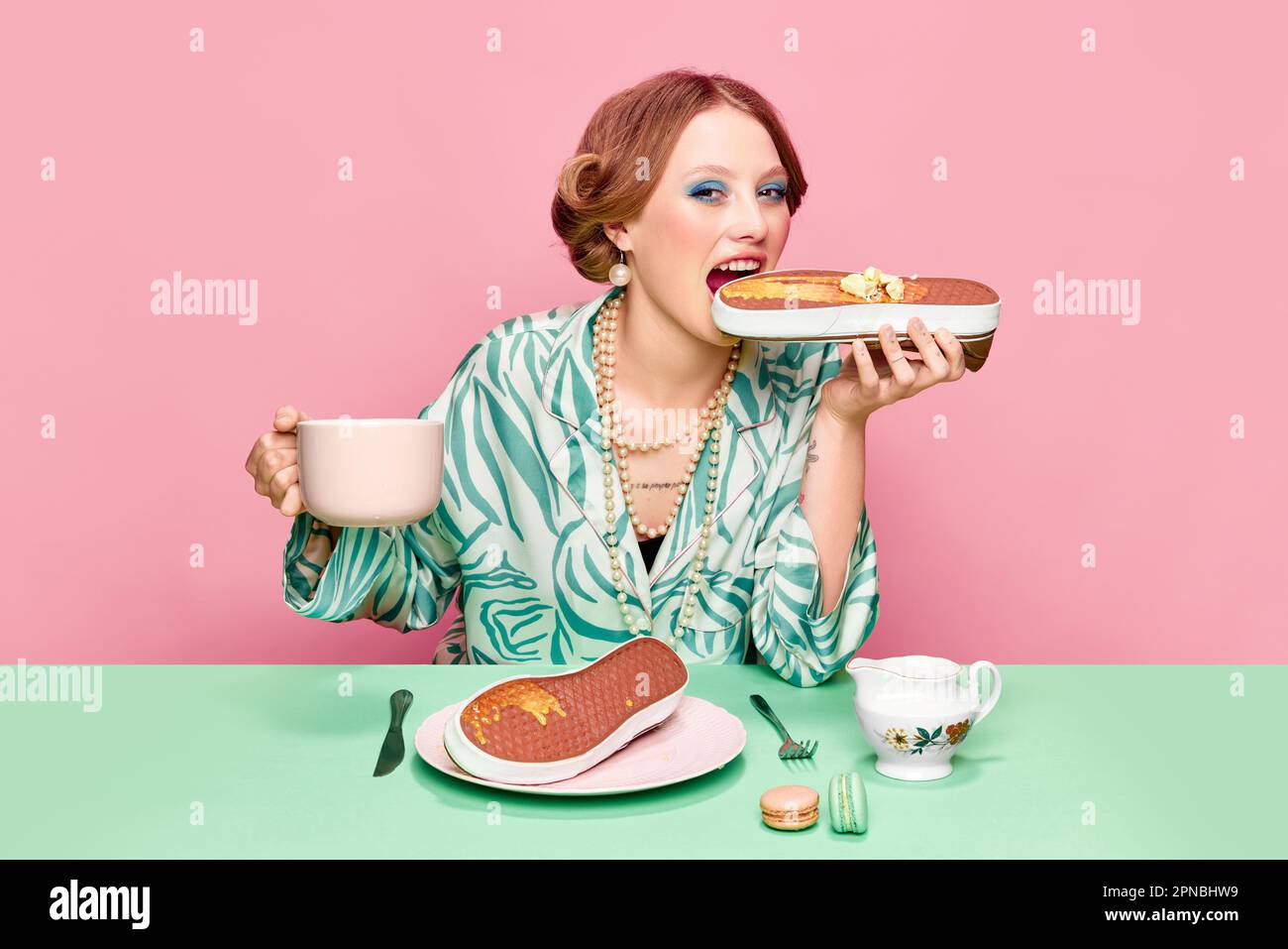 Pretty young girl eating surreal sneakers waffles with honey and butter ...