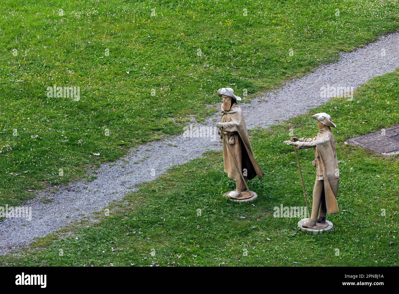 Statues of pilgrims in the village. Via Podiensis (the way of Puy) one ...
