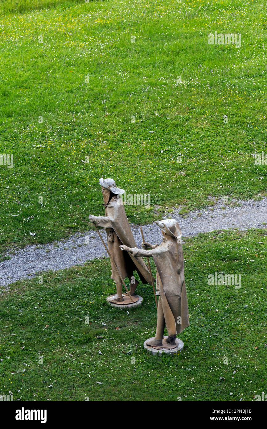 Statues of pilgrims in the village. Via Podiensis (the way of Puy) one ...
