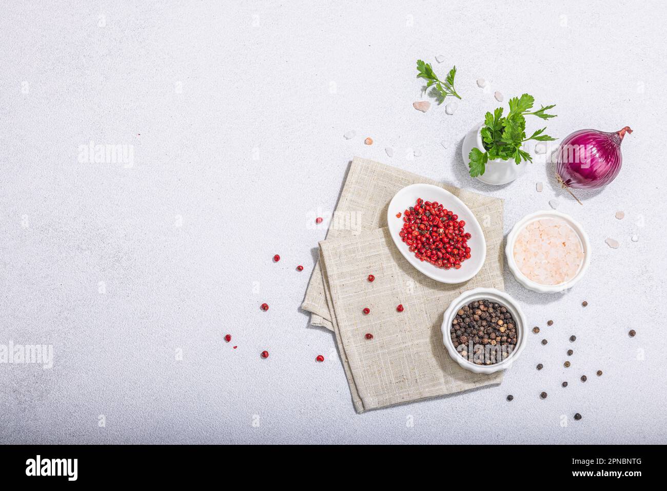 Kitchen cooking background with assorted peppercorn, purple onion ...