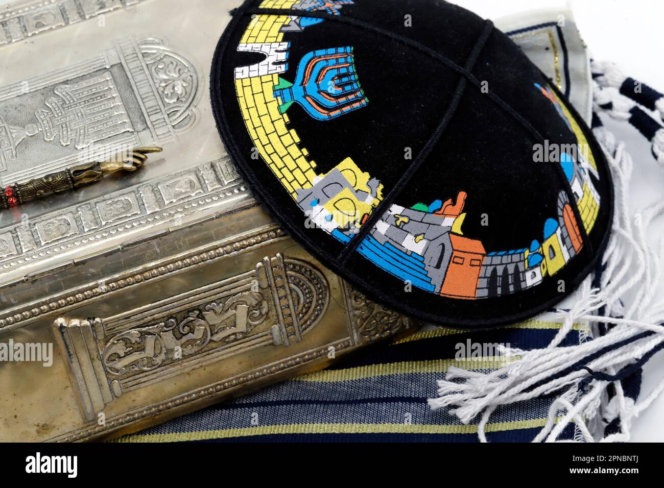 Kippah jewish cap, tallit, yad and Torah book. Four jewish symbols Stock Photo - Alamy