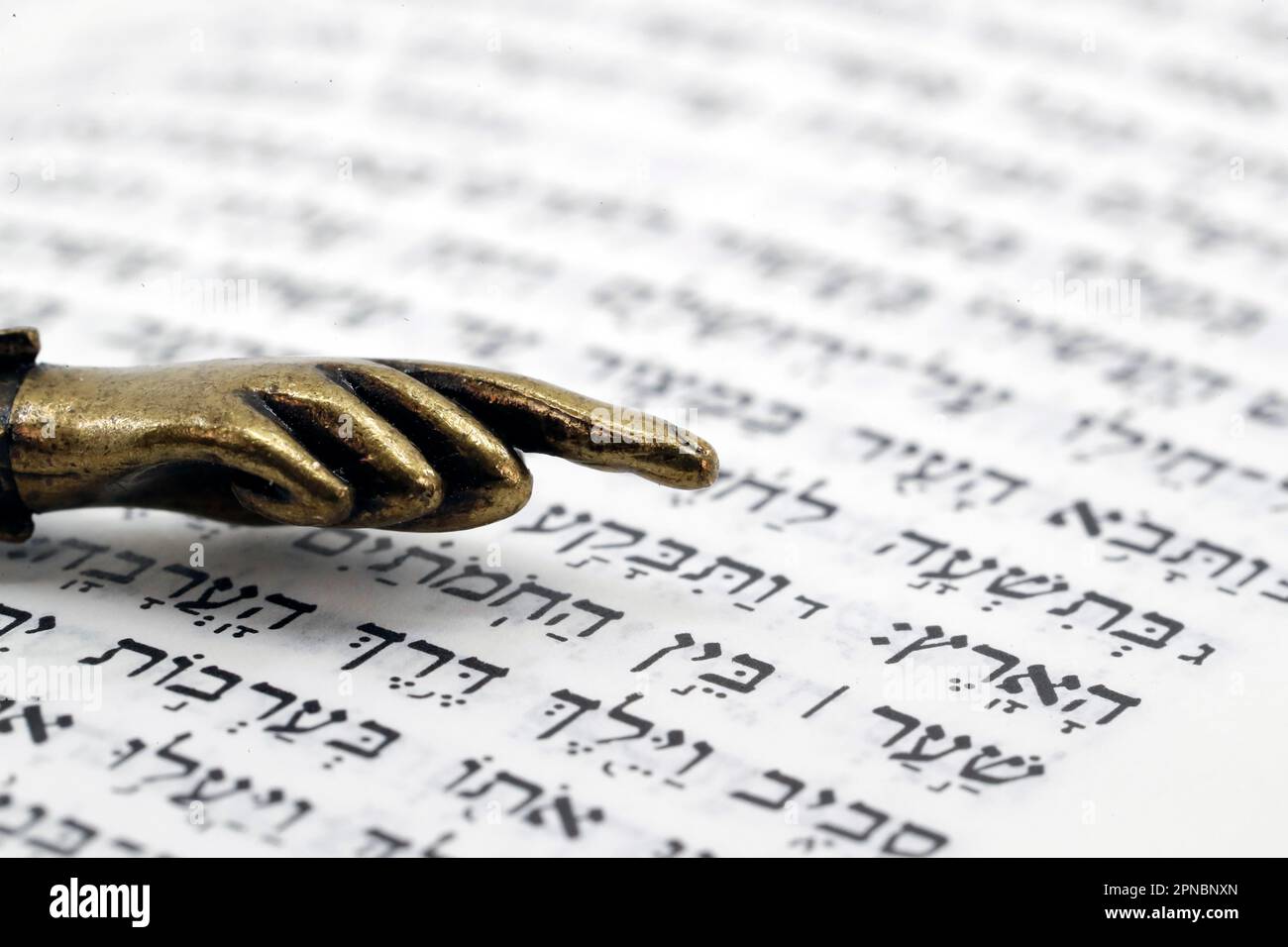 Close-up detail of a Torah in hebrew and a yad. Jewish symbols Stock ...
