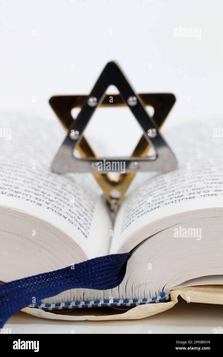 Close-up detail of a Torah in hebrew and a star of David. Jewish ...
