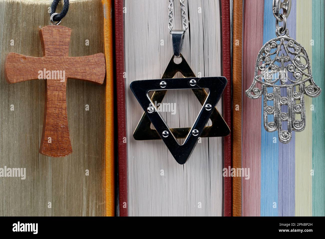 Religious symbols. Quran, Bible and Torah. Christian cross, star of ...