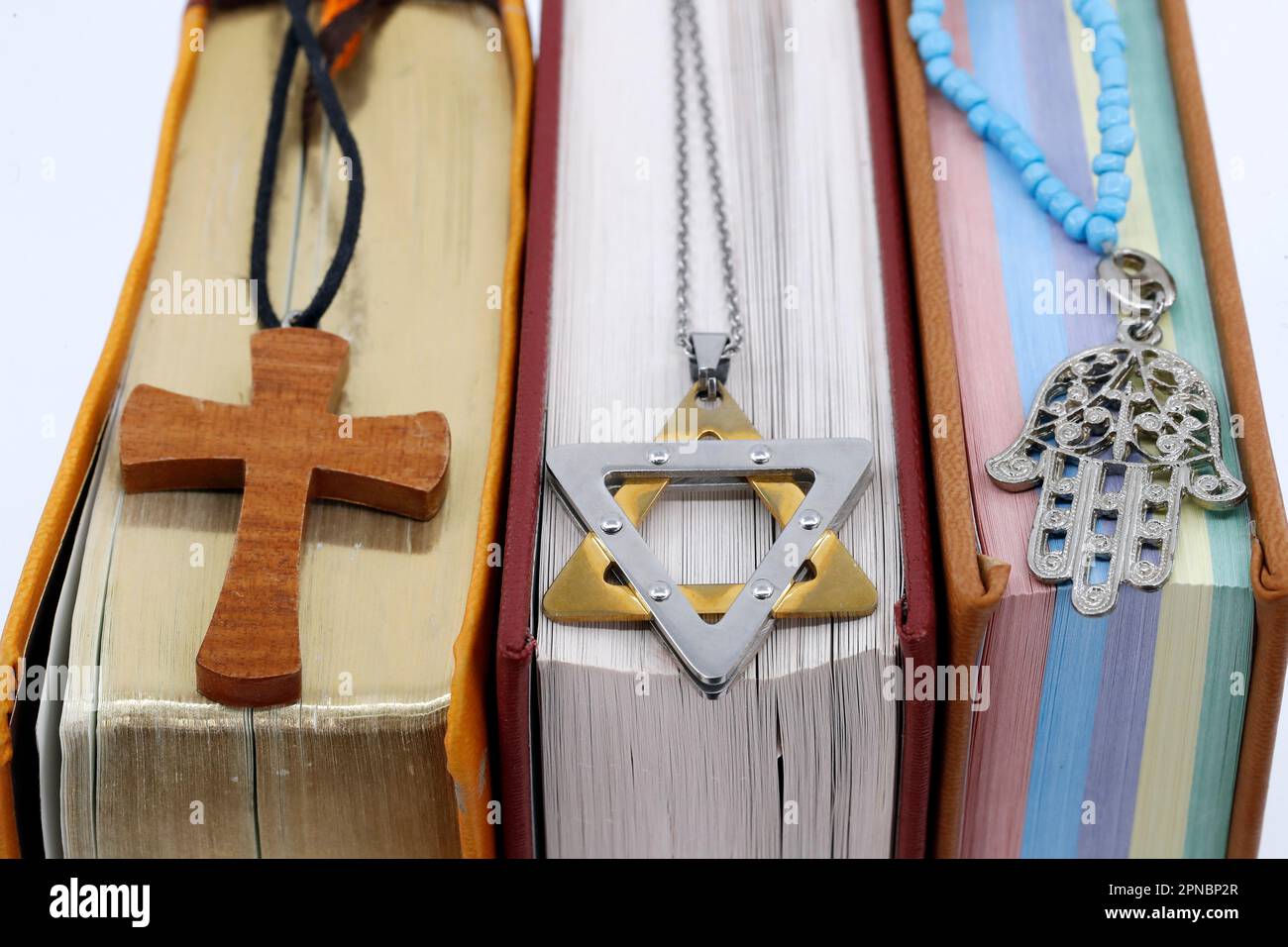 Religious symbols. Quran, Bible and Torah. Christian cross, star of ...