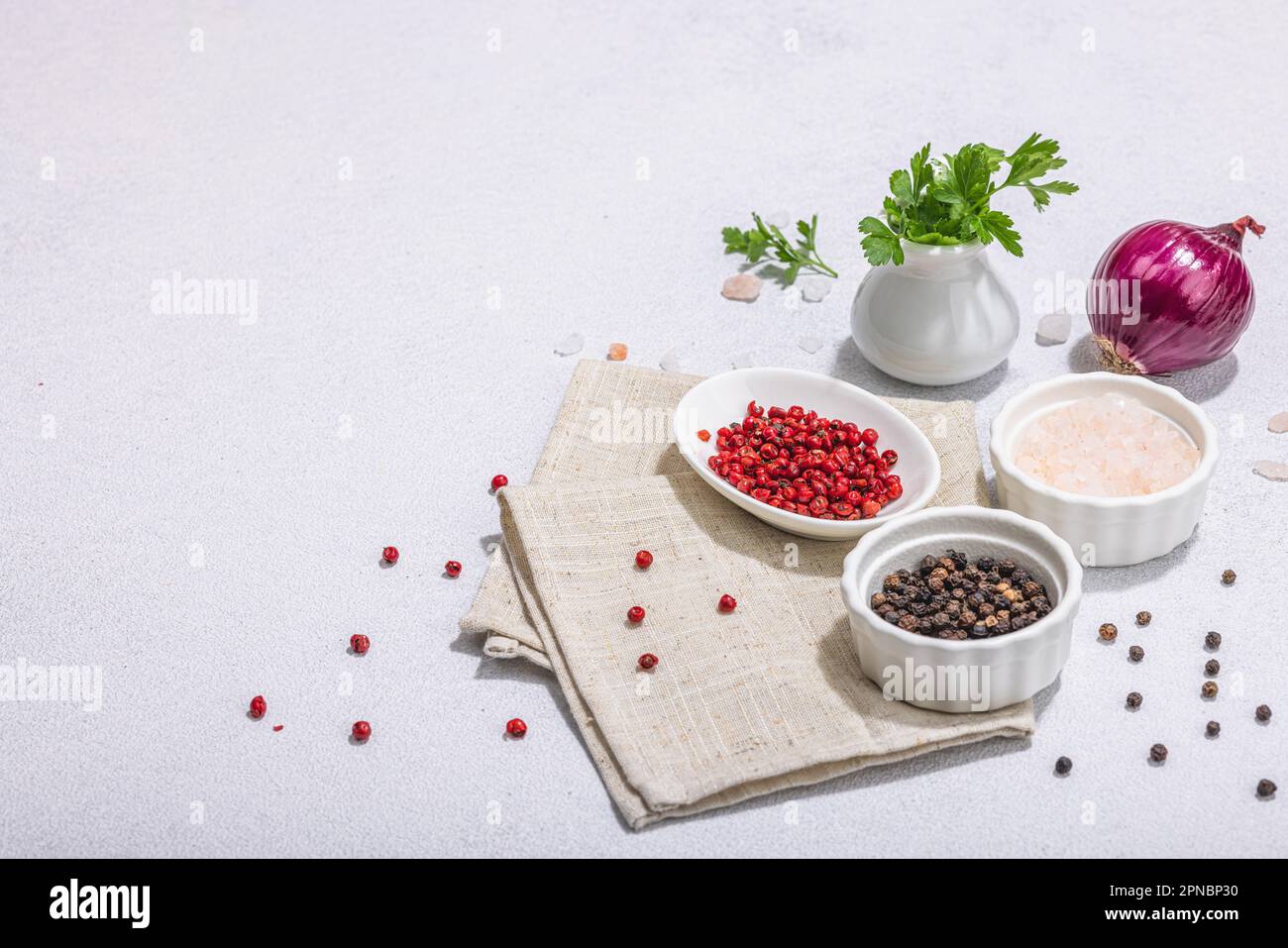 Kitchen cooking background with assorted peppercorn, purple onion ...