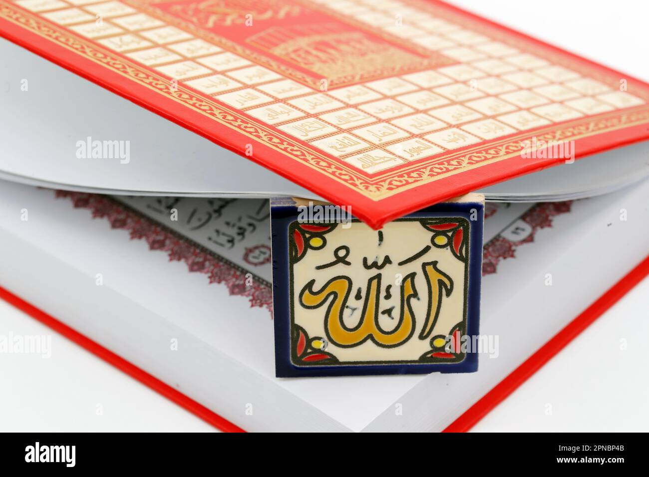 Cover of the Holy Quran (Koran) with the 99 names of Allah in arabic ...