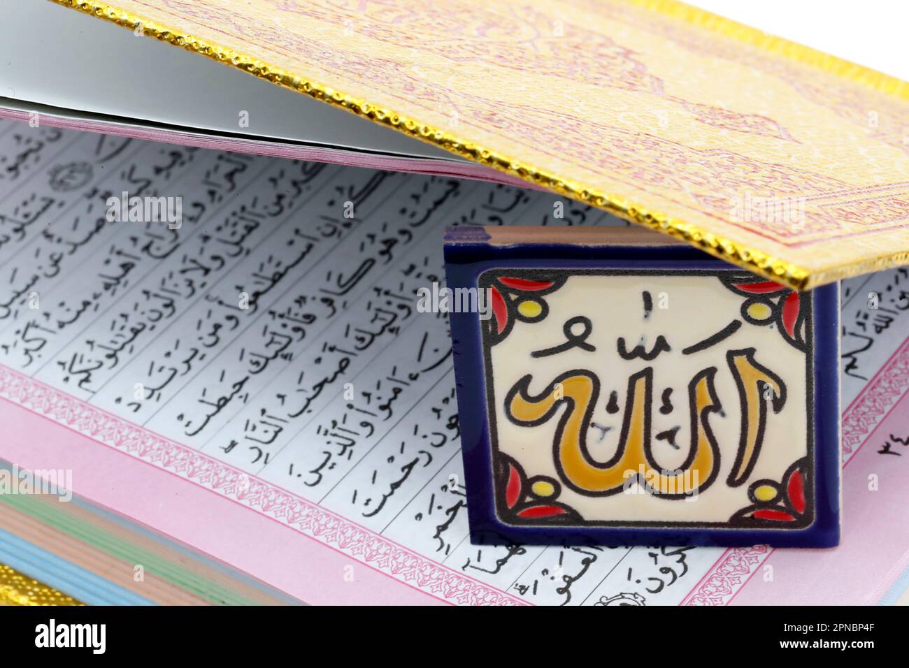 Cover of the Holy Quran (Koran) with the name of Allah in arabic ...