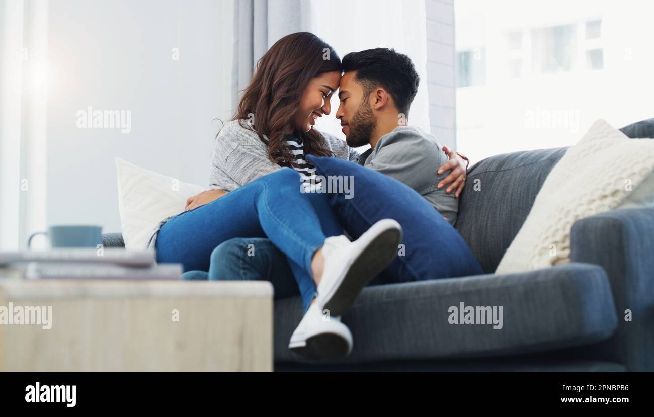 This is what love looks like. an affectionate young couple cuddling ...