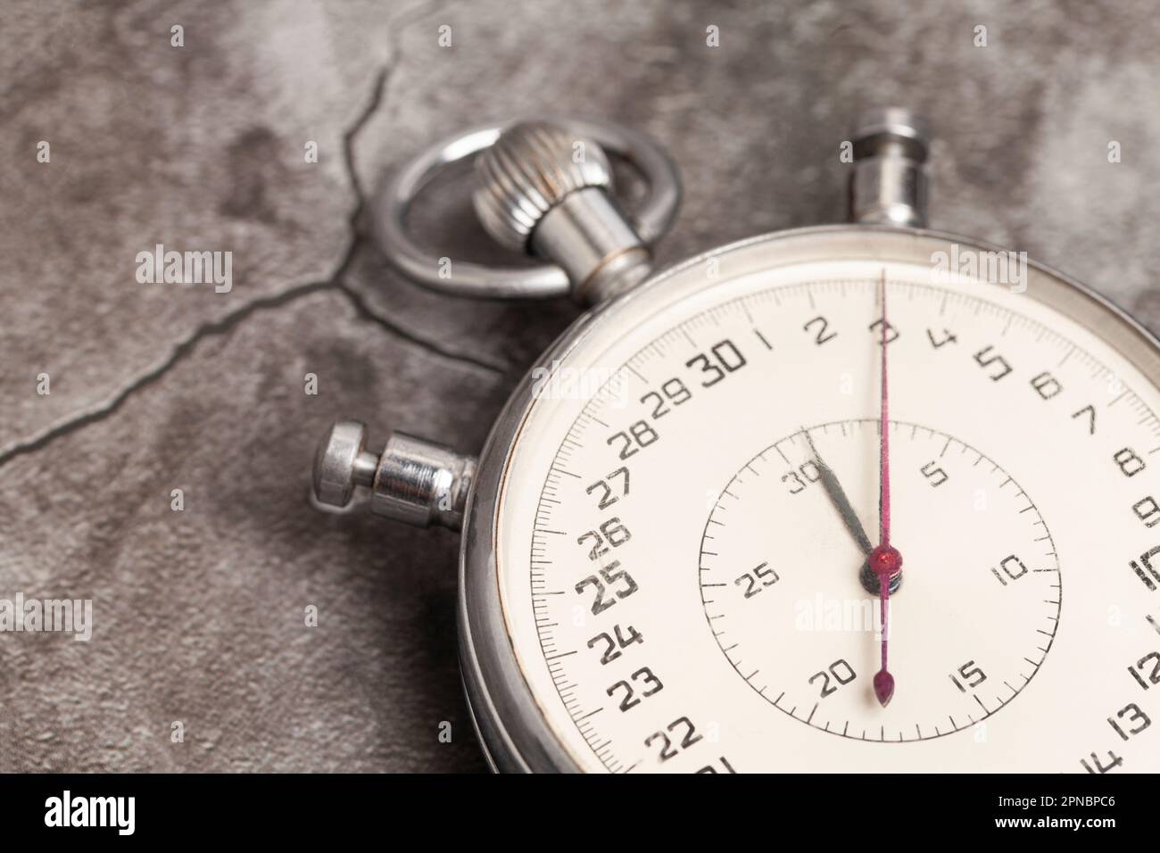 Old stopwatch on a gray background Stock Photo - Alamy