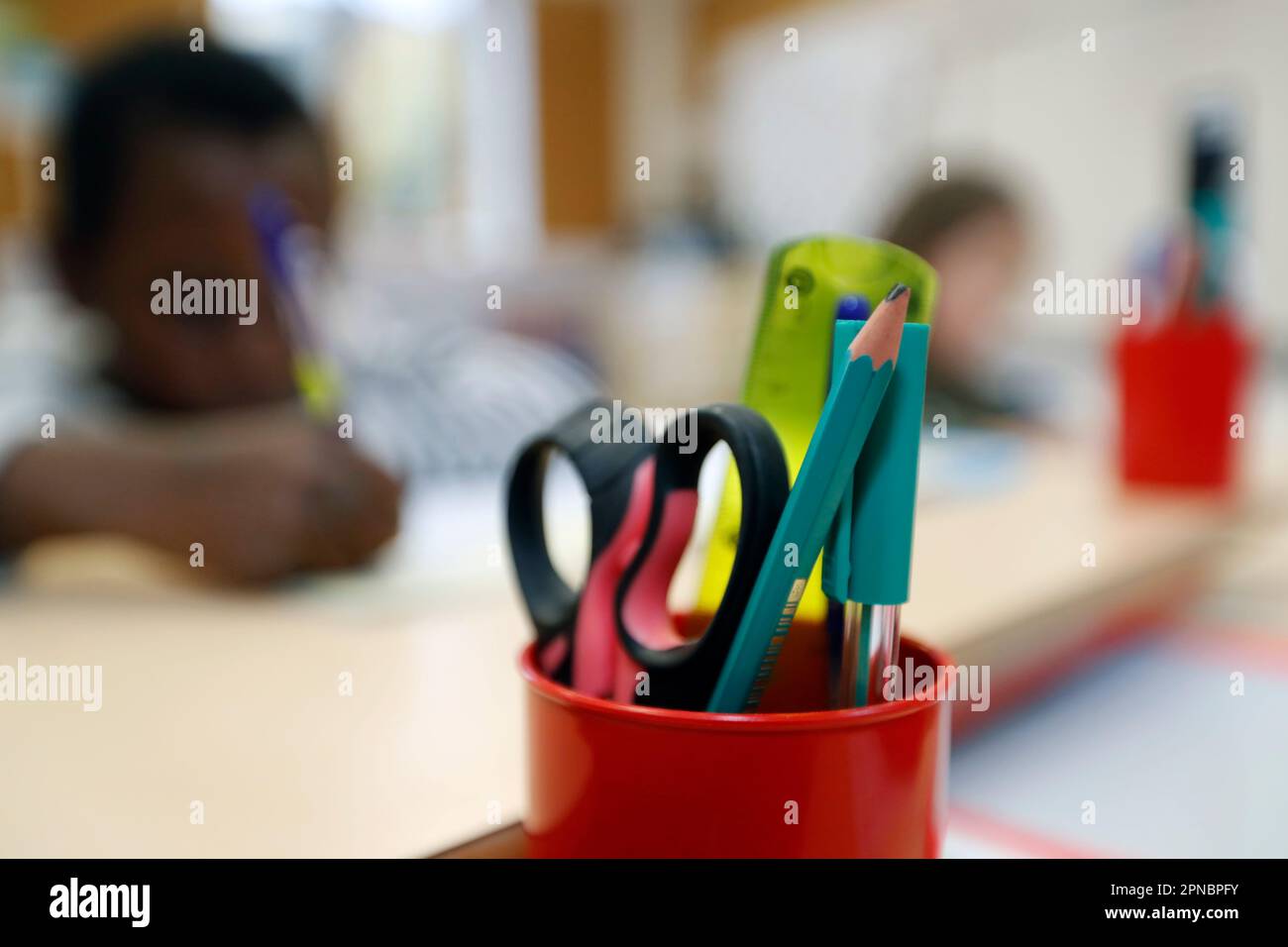 Education. Classroom in a primary school. Pupils writing. Pupil writing ...