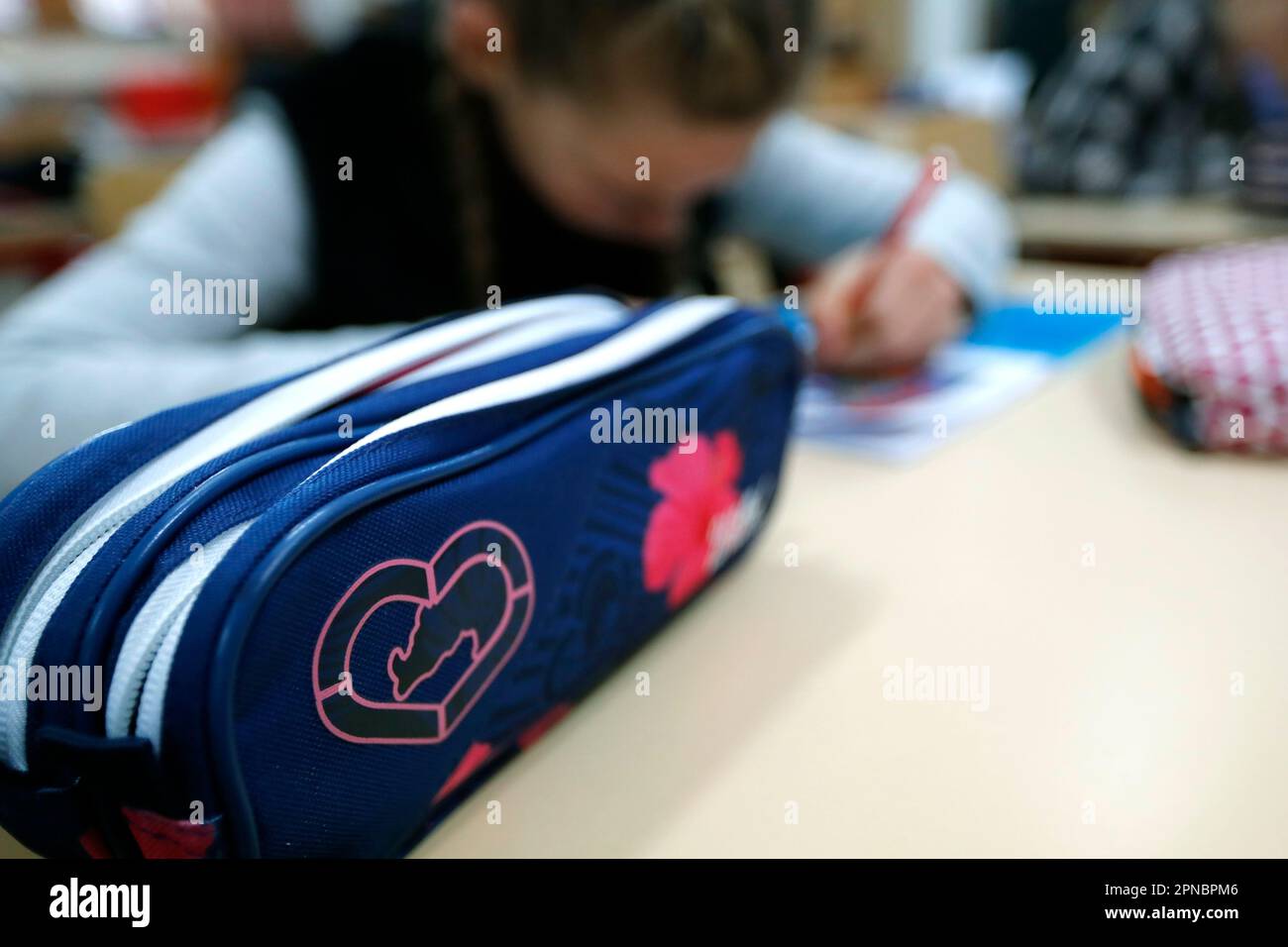 Education. Classroom in a primary school. Pupil writing. Saint-Gervais ...