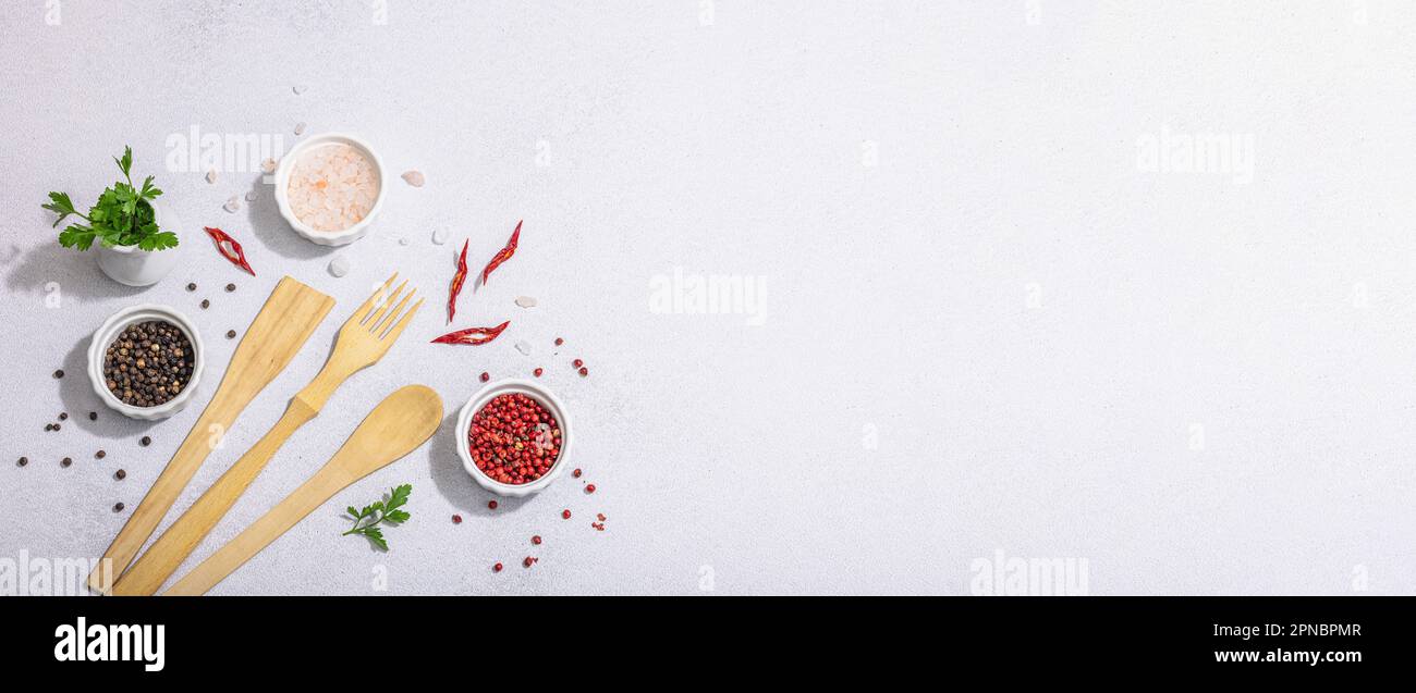 Culinary background with wooden kitchen utensil, spices and herbs. Set ...