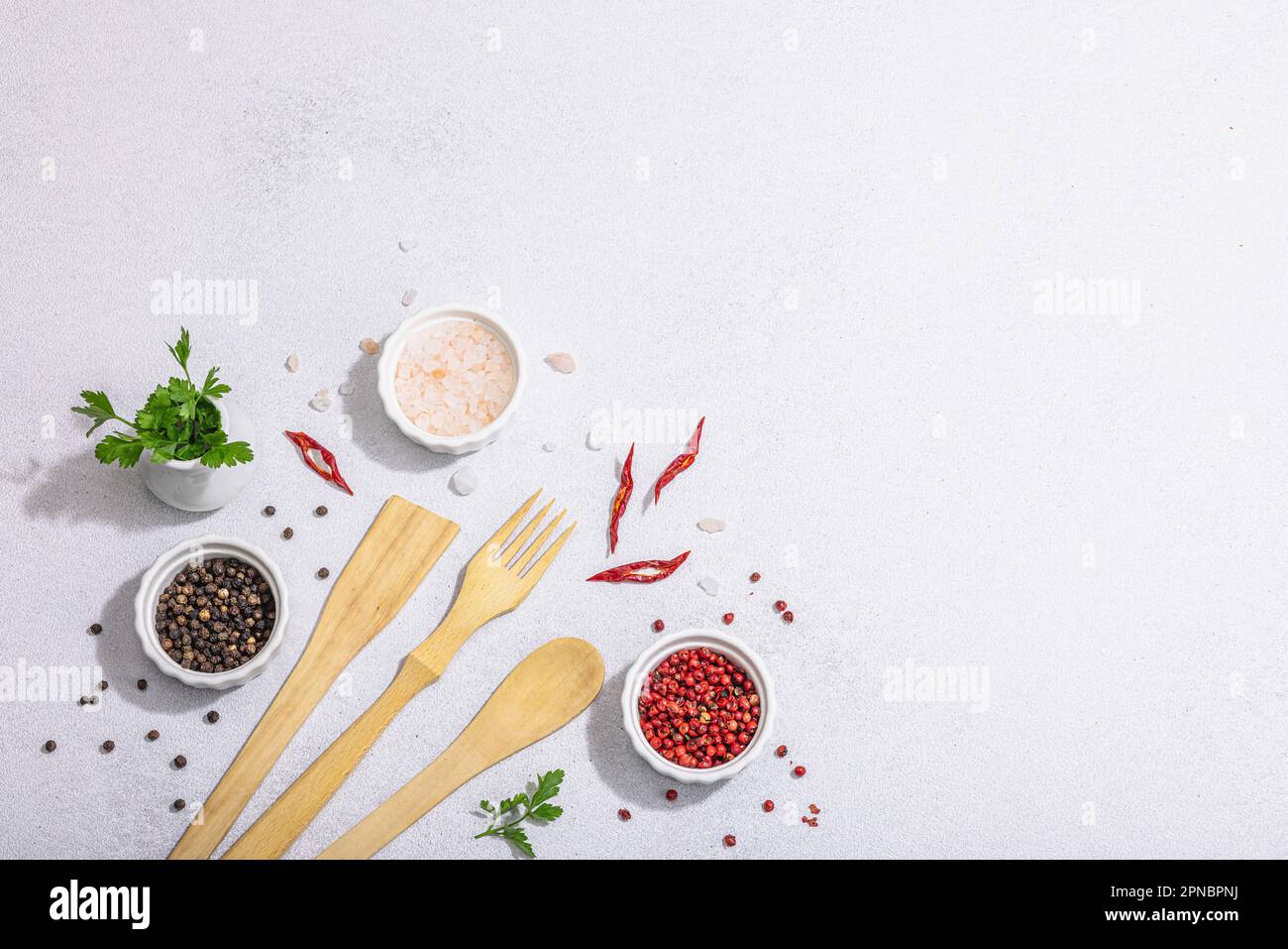 Culinary background with wooden kitchen utensil, spices and herbs. Set ...