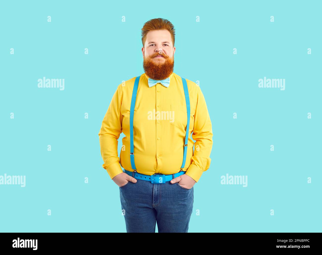 Portrait of extravagant confident and stylish chubby man on light blue ...
