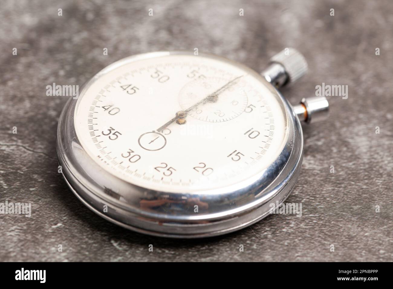 Old stopwatch on a gray background Stock Photo - Alamy