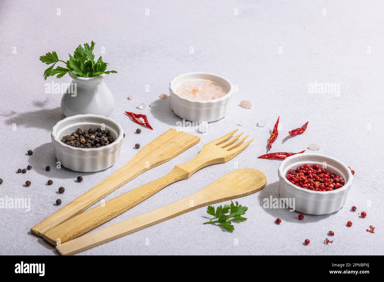 Culinary background with wooden kitchen utensil, spices and herbs. Set ...