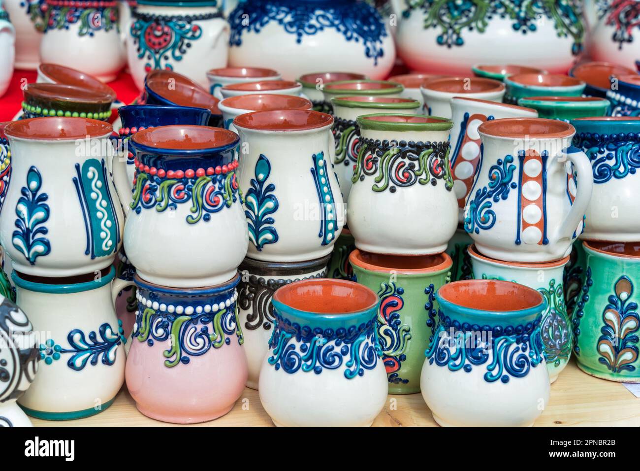 Traditional romanian handmade ceramic pottery mugs with rustic ...