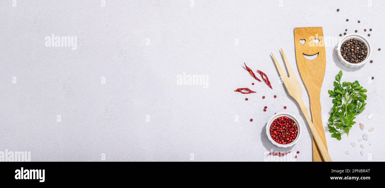 Culinary background with wooden kitchen utensil, spices and herbs. Set ...