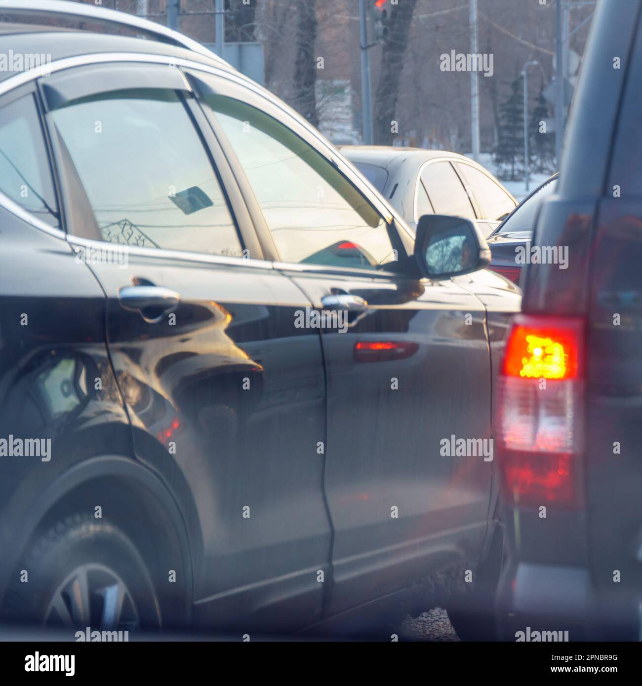 Cars standing in a traffic jam on a city street Stock Photo - Alamy