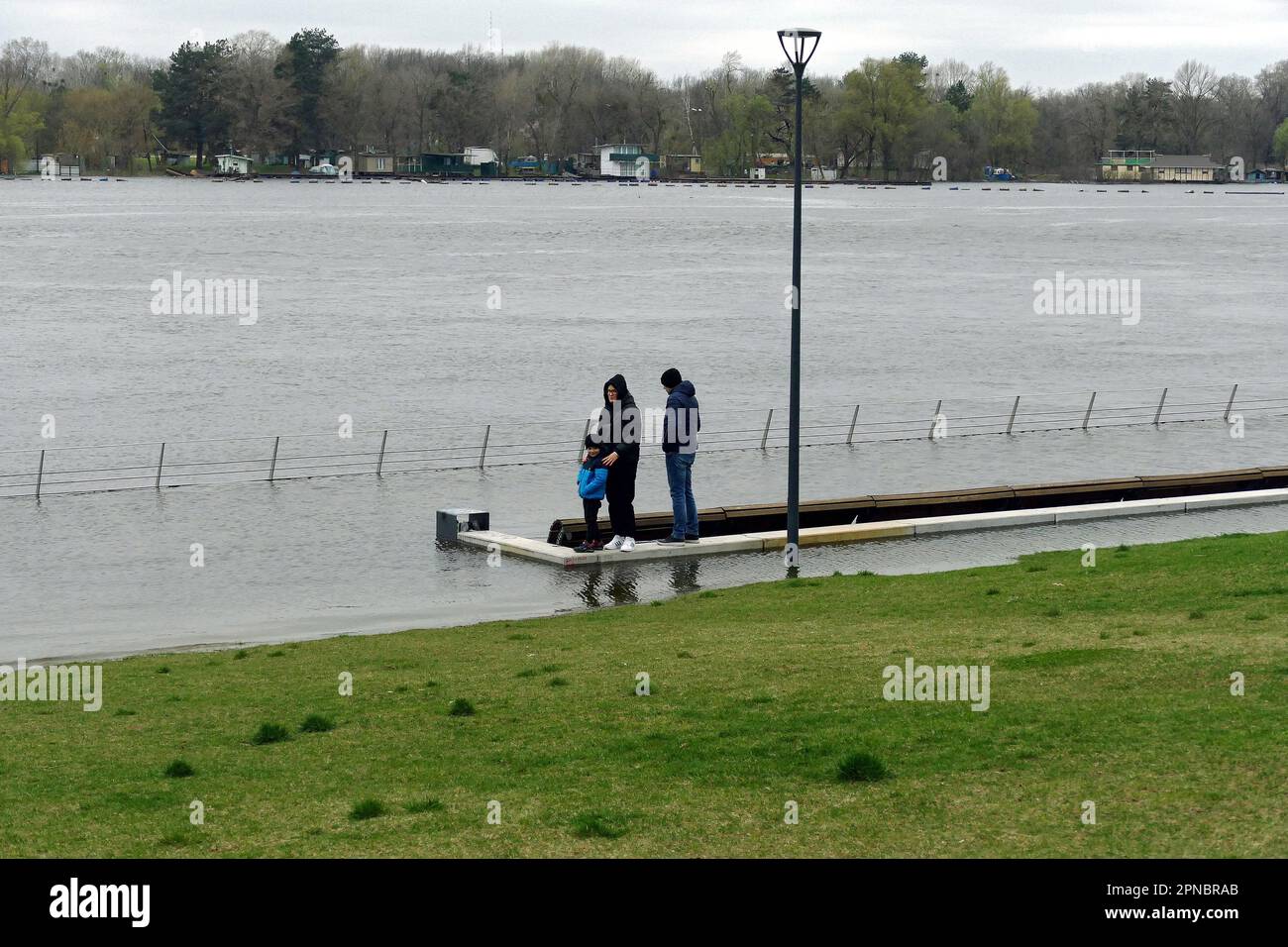 KYIV, UKRAINE - APRIL 15, 2023 - A man, woman and boy stand on the ...