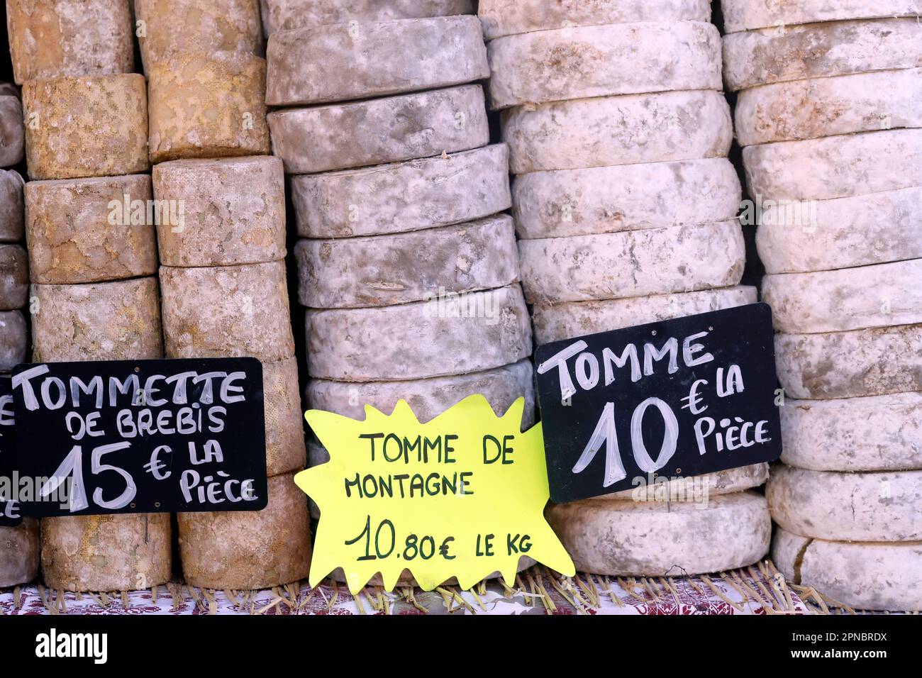 Traditional French cheese : Raclette and Morbier. Mountain cheese for ...