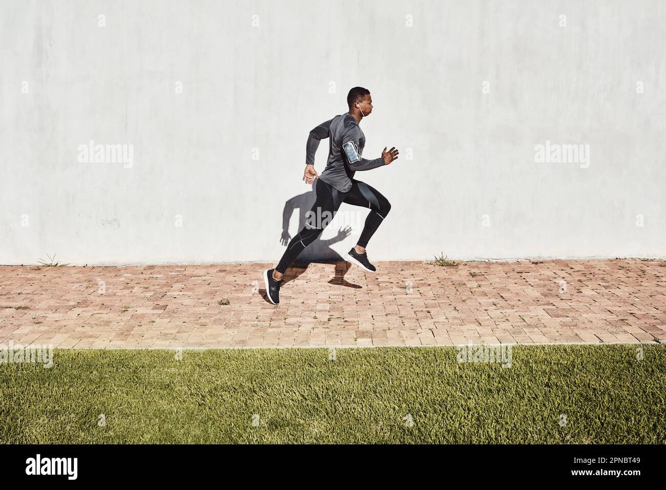 Hes focused on getting fit. Full length shot of a handsome and athletic ...