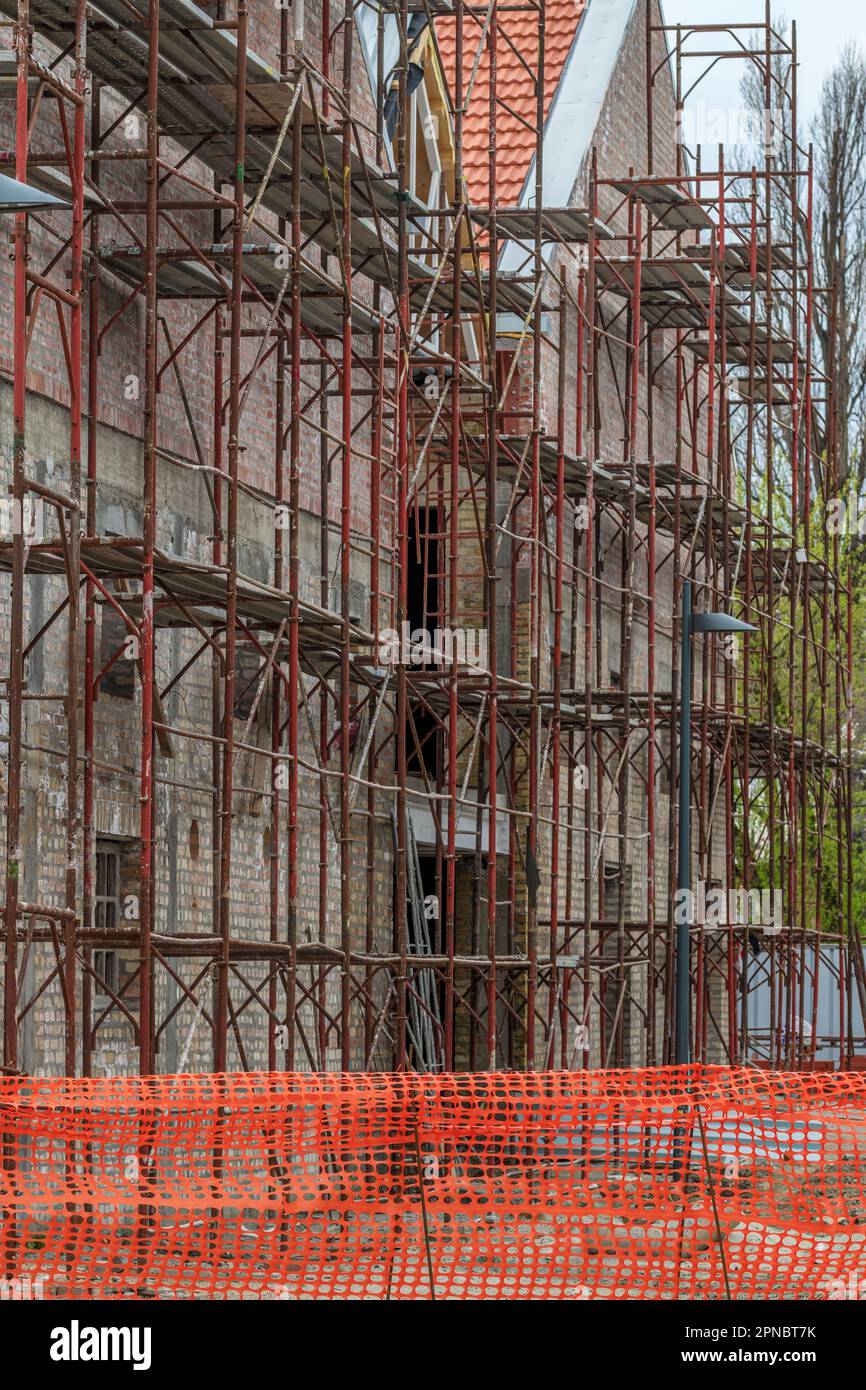 Scaffolding structure on construction site, renovation of an old ...