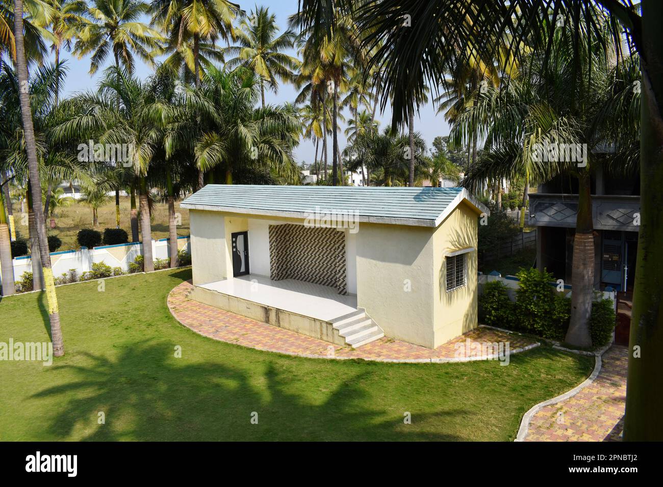 Top view of the beautiful club house with Coconut trees, garden at ...