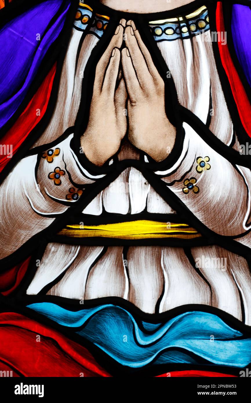 Song Vinh Church. Stained glass. Virgin Mary praying. Close-up on hands ...
