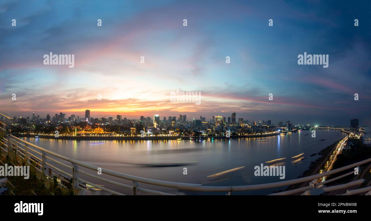 The golden afterglow over Cambodia's capital city,it's busy Riverside ...