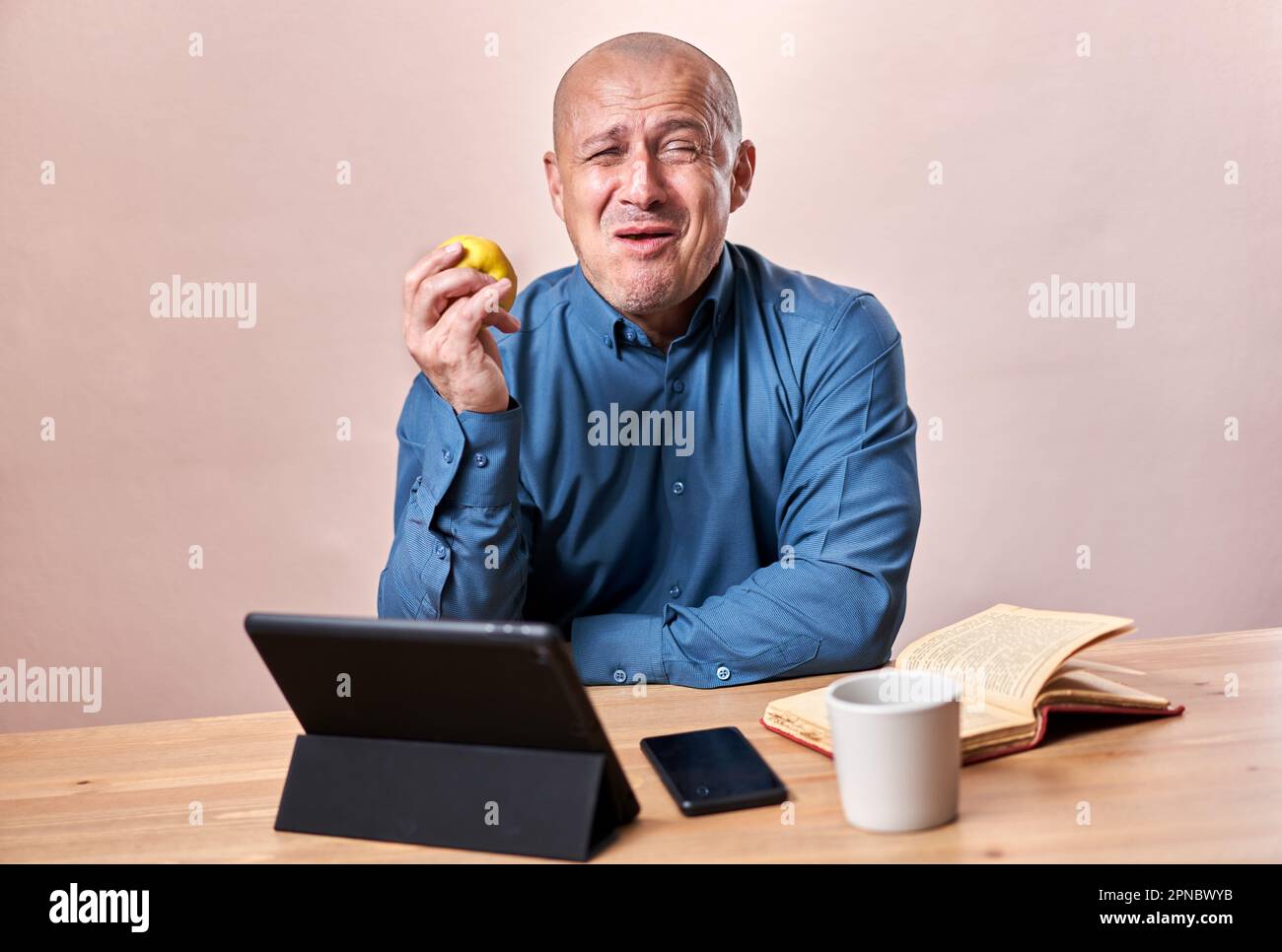 Male teacher eating apple hi-res stock photography and images - Alamy