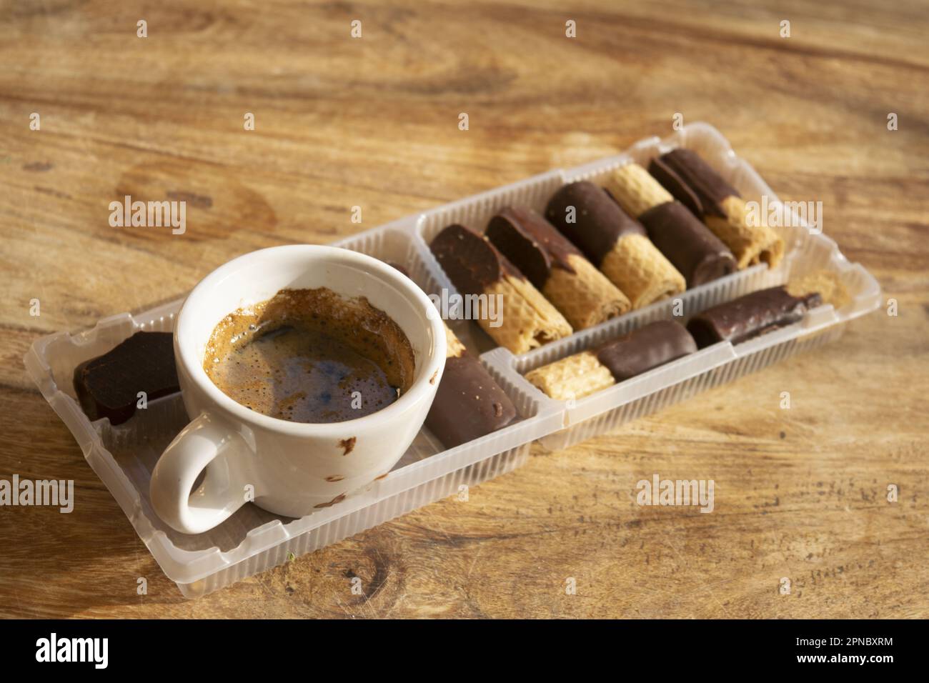 espresso coffee with round wafer cookies with chocolate Stock Photo - Alamy
