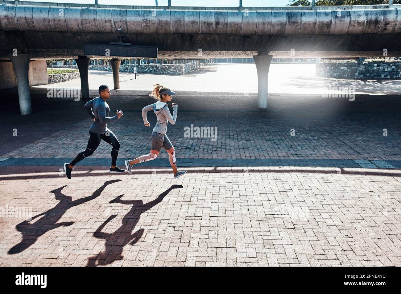Conquering their fitness goals together. Full length shot of two young ...
