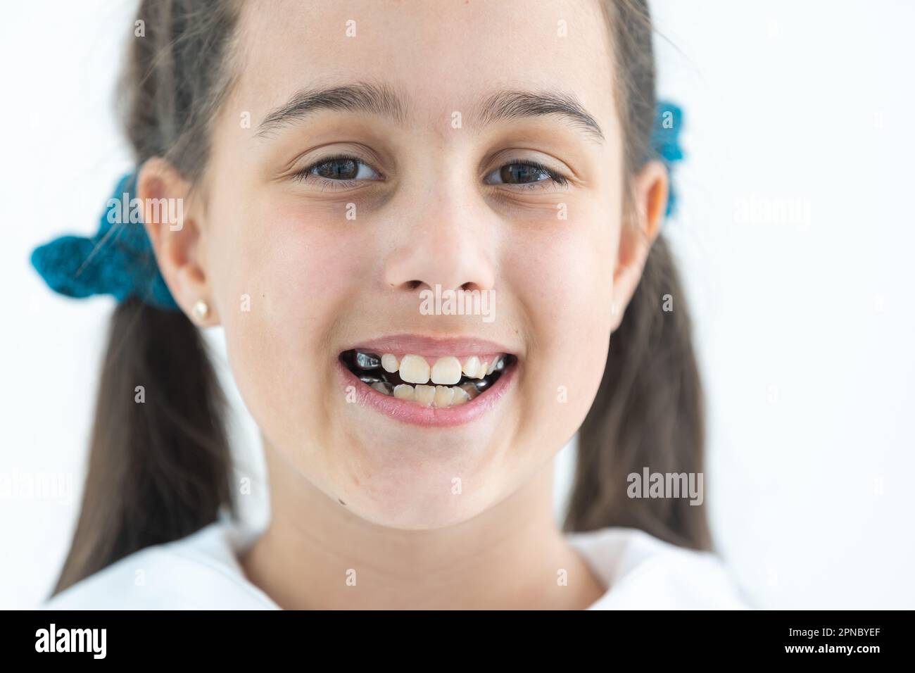 little girl showing her healthy teeth at dental office, smiling and ...