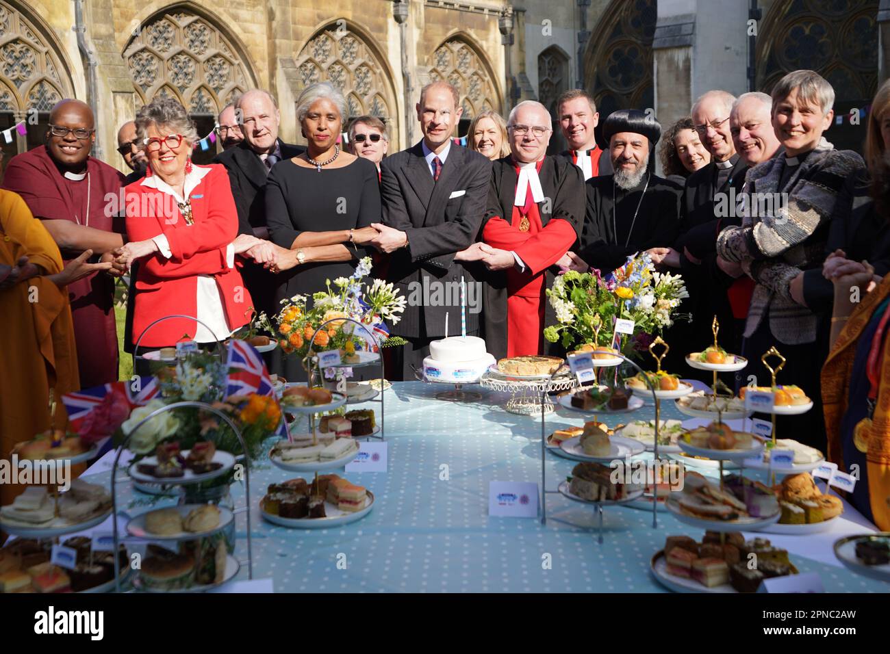 The Duke of Edinburgh links arms with guests at a Coronation Big Lunch ...