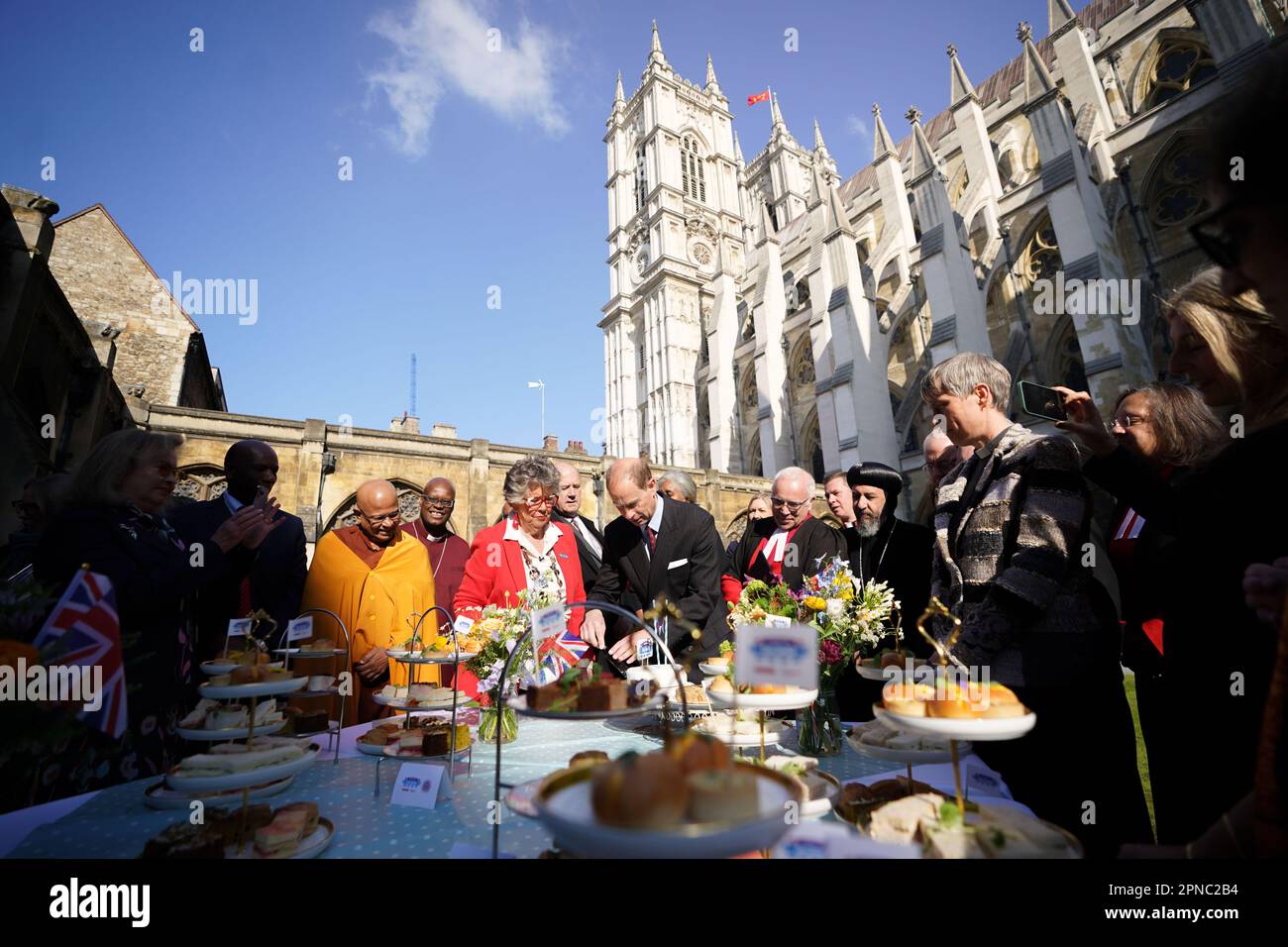 The Duke of Edinburgh cuts a cake at a Coronation Big Lunch hosted by ...