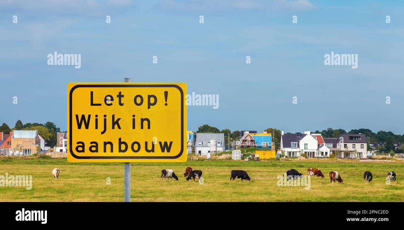Traffic sign with the Dutch text for "Attention - Residential area ...