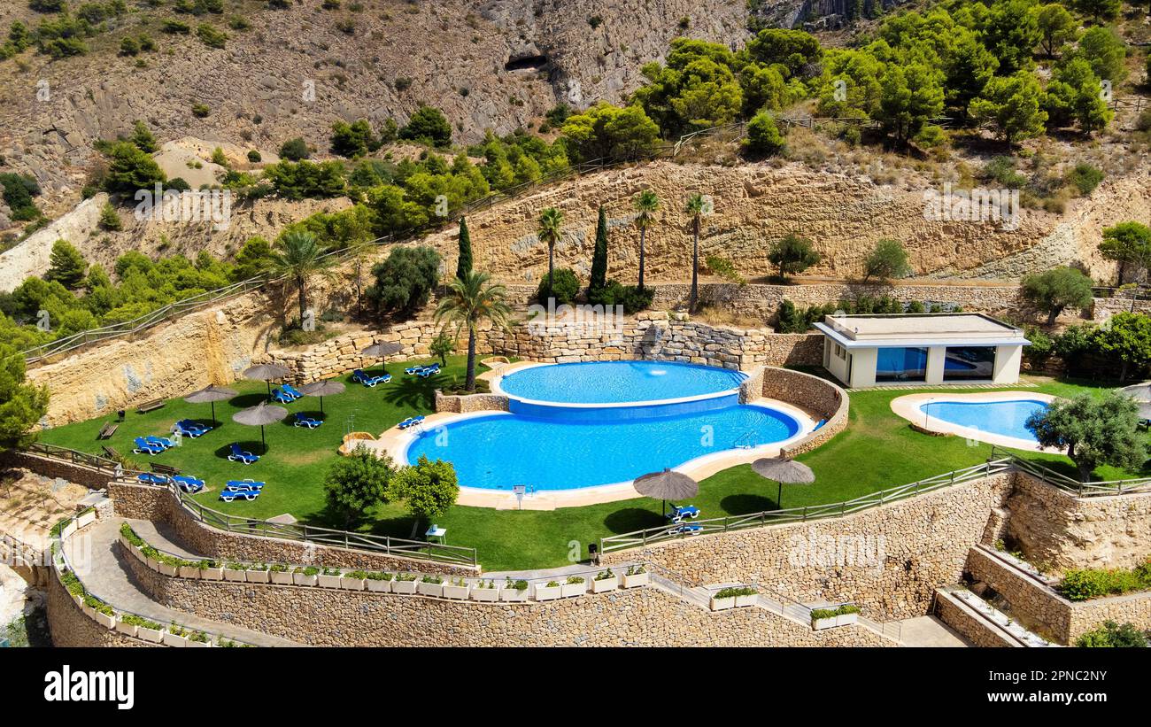 summer vacation and travel concept - aerial view of luxury swimming ...