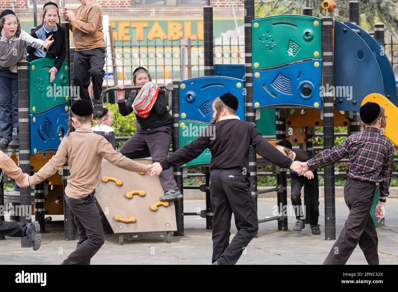 A group of parochial school students enjoying their recess in a small ...