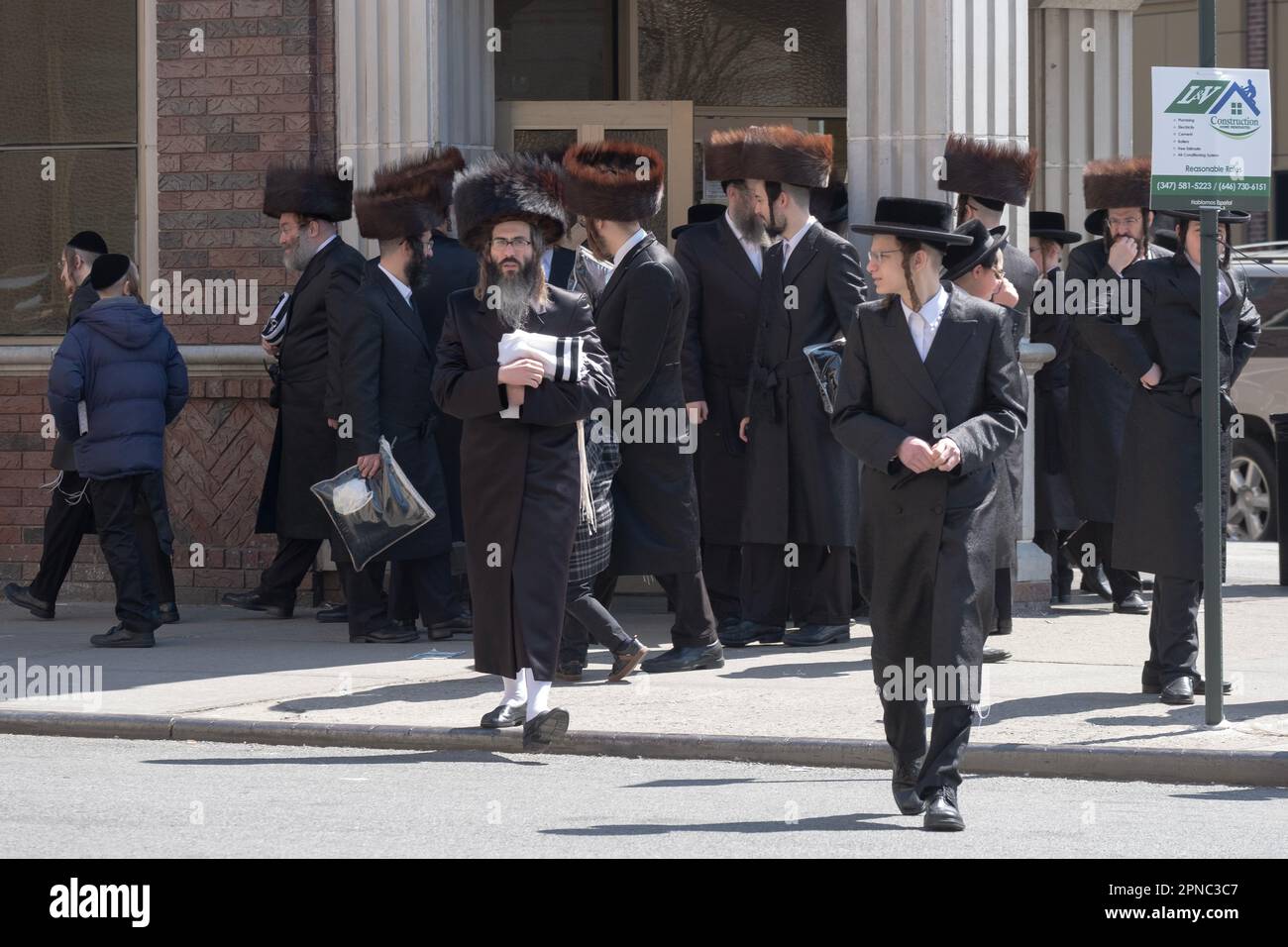 Jewish men from the Satmar Hasidic group leave their synagogue after ...