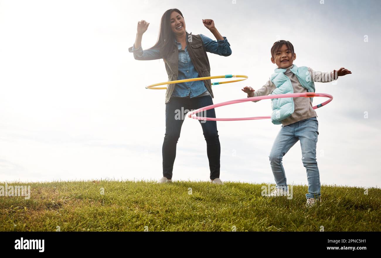 Its always fun when theres hulas around. a little girl and her mom ...