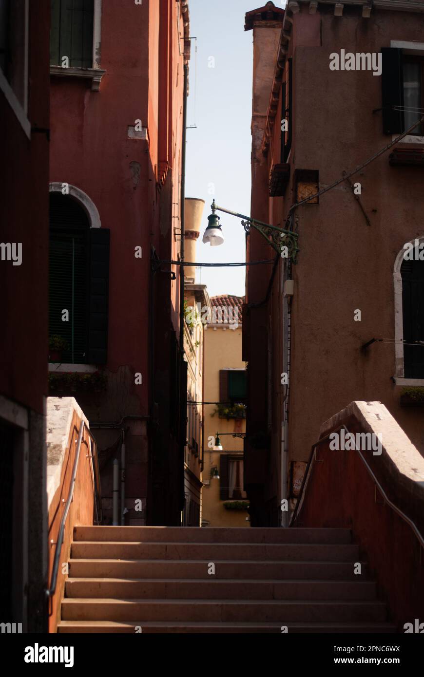 View of stairs on street in old town in sunlight Stock Photo - Alamy