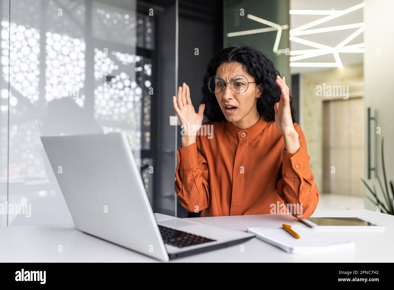Annoyed and angry businesswoman inside office at workplace, hispanic ...
