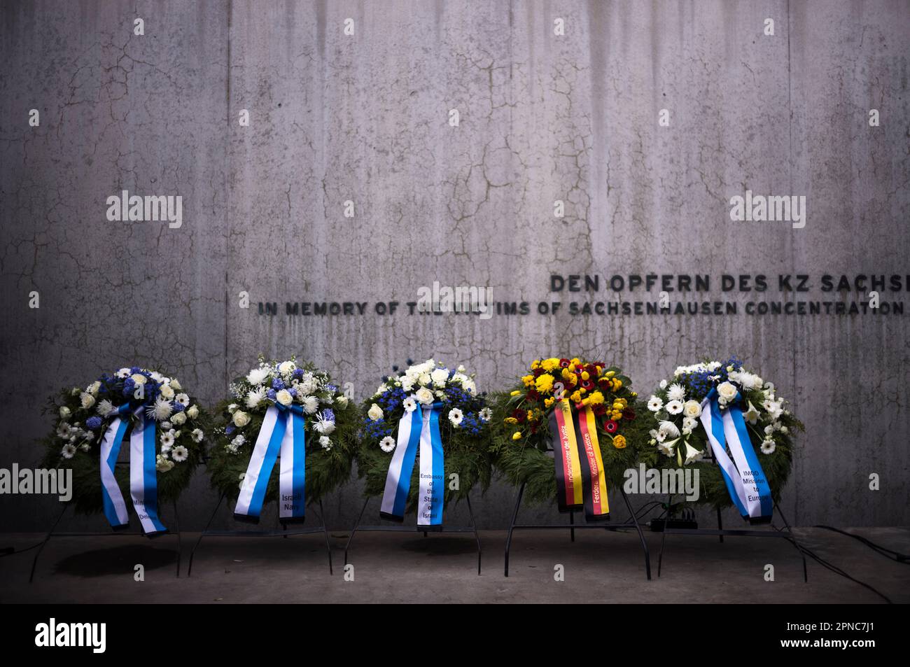 Wreaths at the memorial wall of the Nazi concentration camp ...