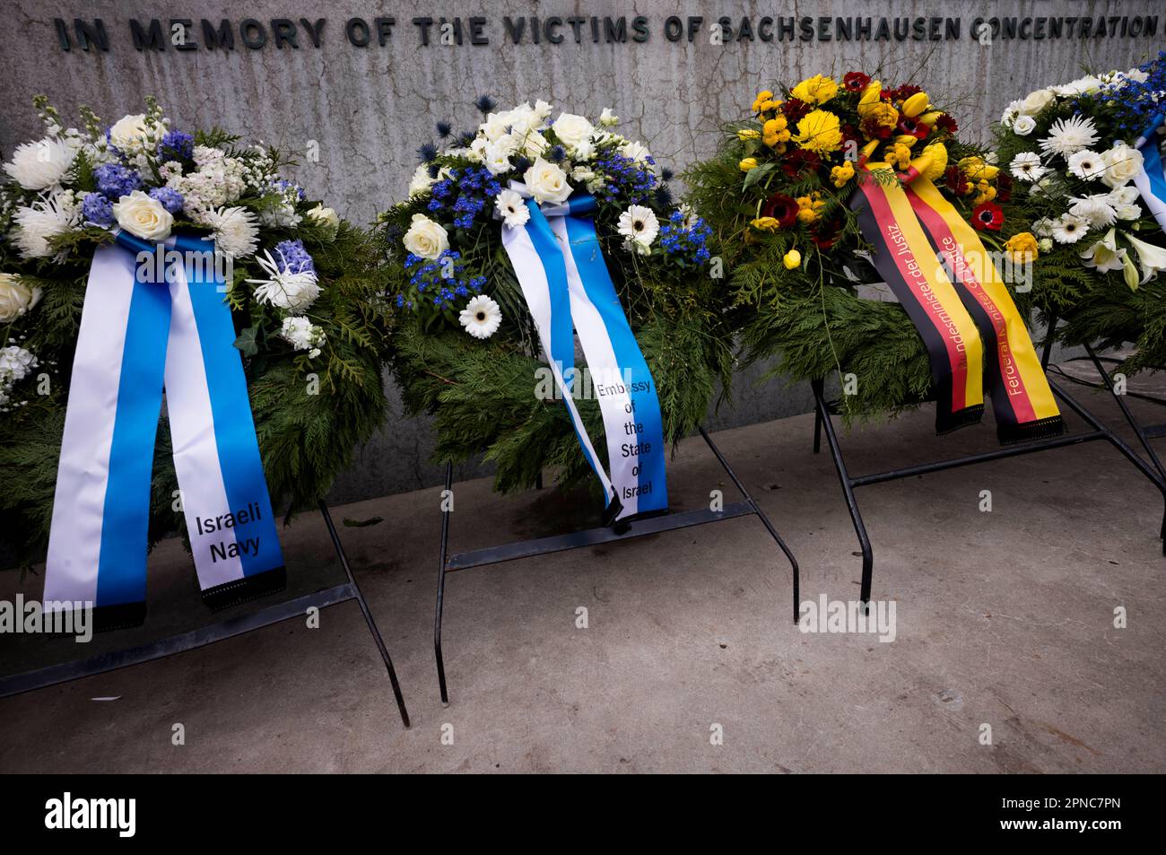 Wreath at the memorial wall of the Nazi concentration camp ...